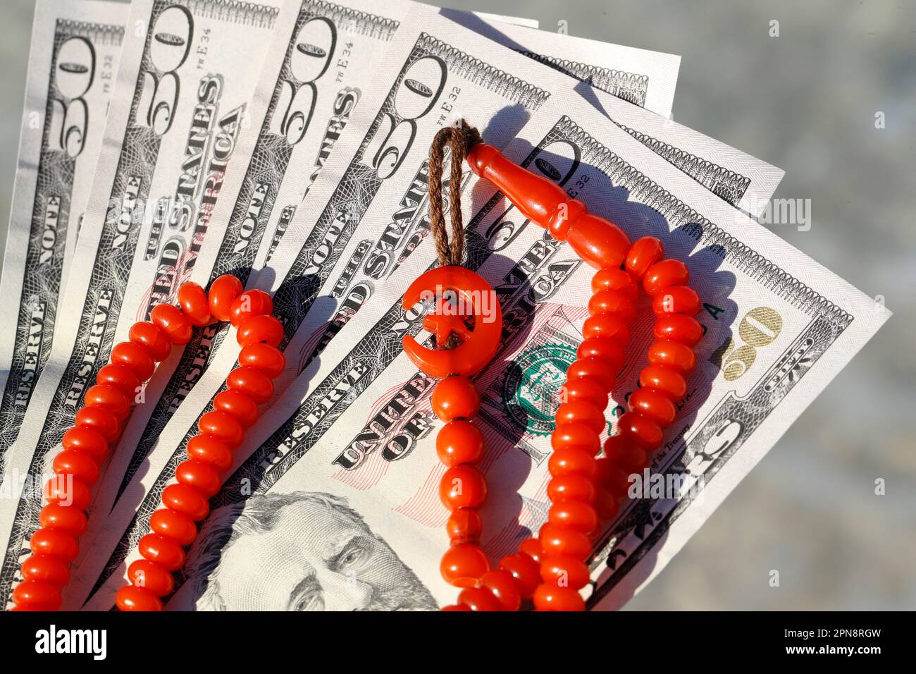 Money and religion. Banknotes of US dollars with Holy Quran book ...