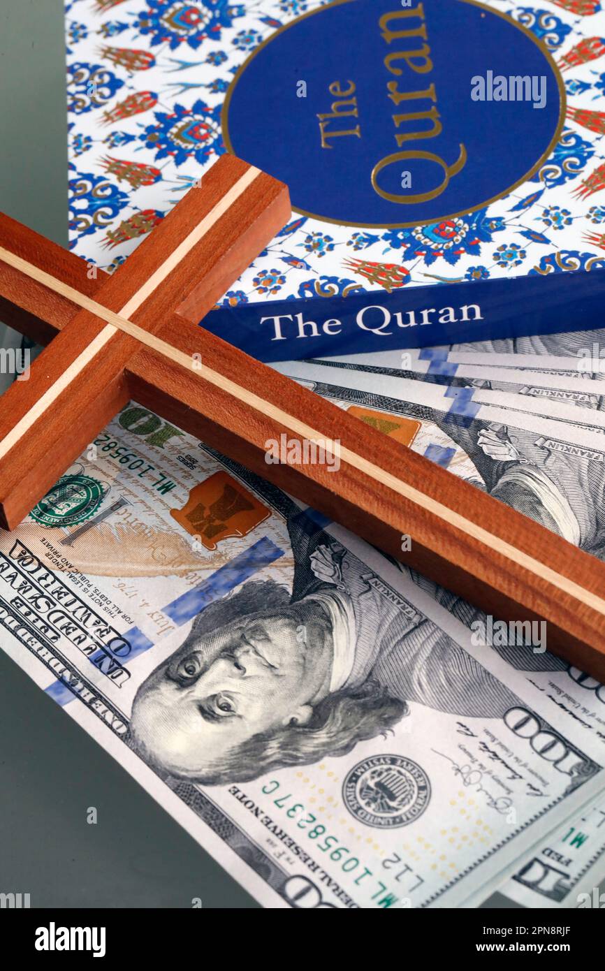 Money, religion and interfaith. Banknotes of US dollars with wooden ...