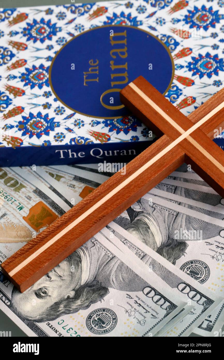 Money, religion and interfaith. Banknotes of US dollars with wooden ...