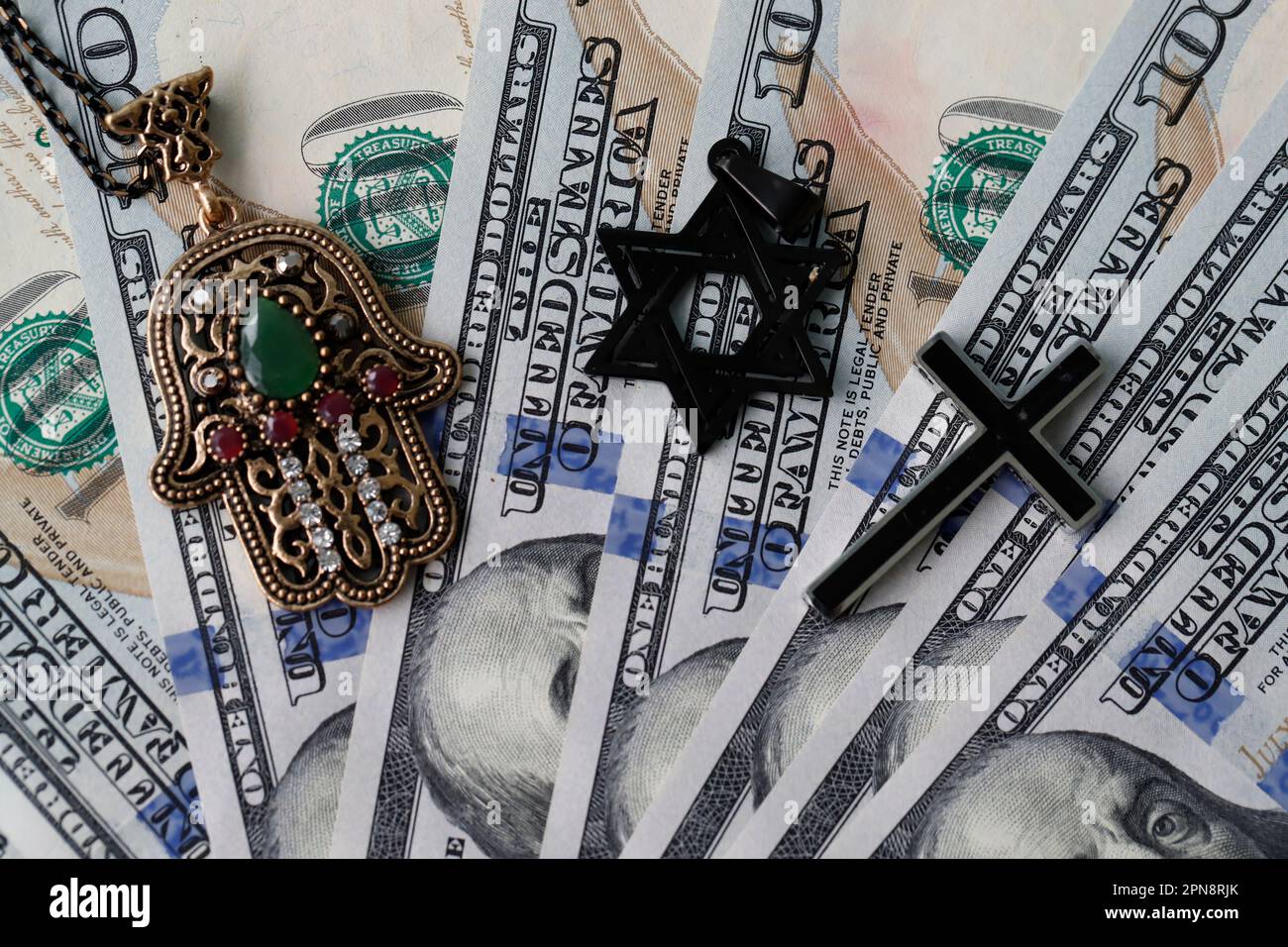 Money, religion and interfaith. Banknotes of US dollars with religious ...