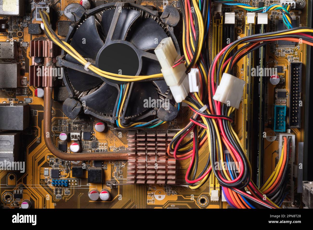 Computer chip in details of the old computer in dust. Motherboard ...