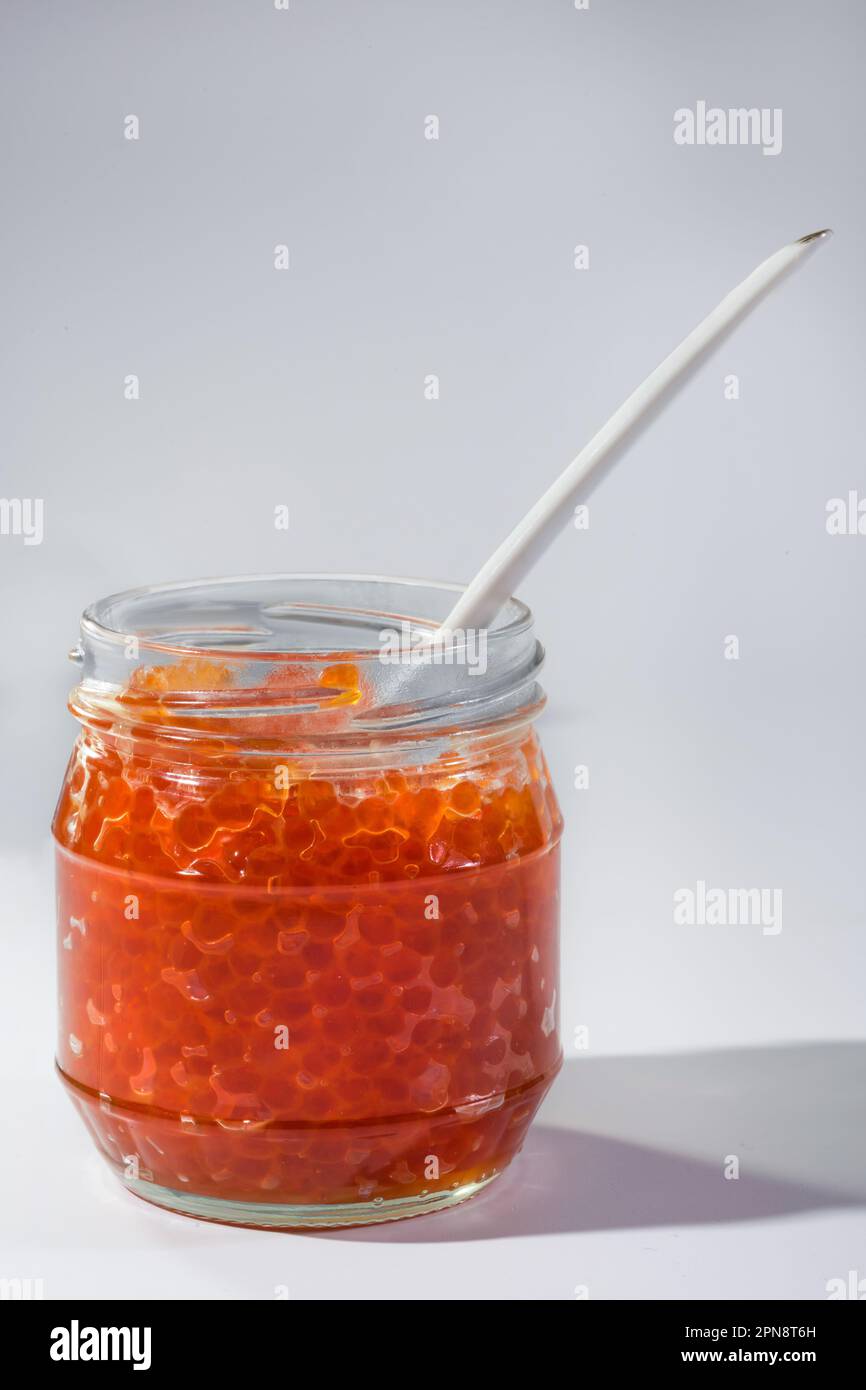 The opened glass jar of red caviar. Seafood Stock Photo - Alamy
