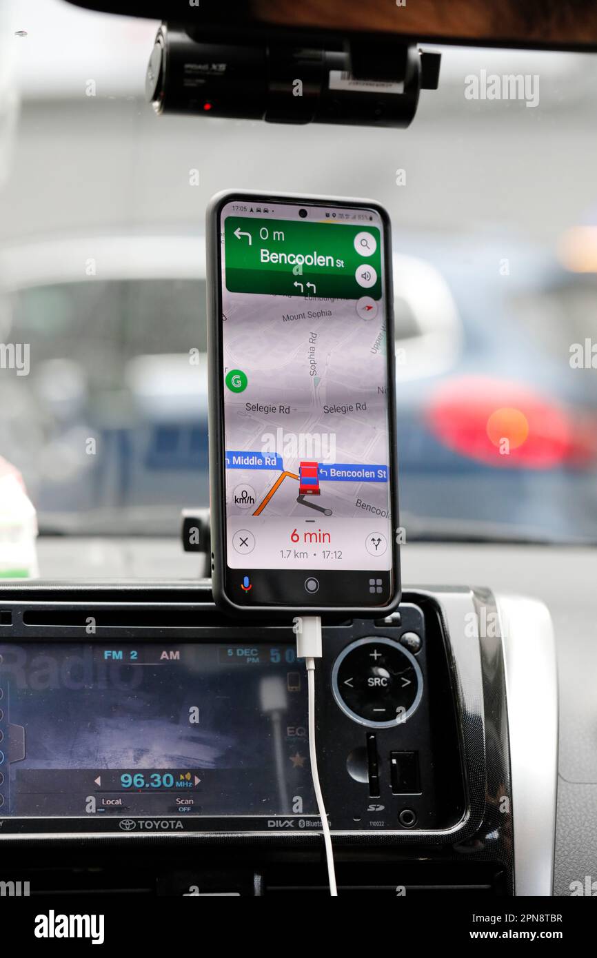 Grab app on a smartphone. Taxi. Singapore Stock Photo - Alamy