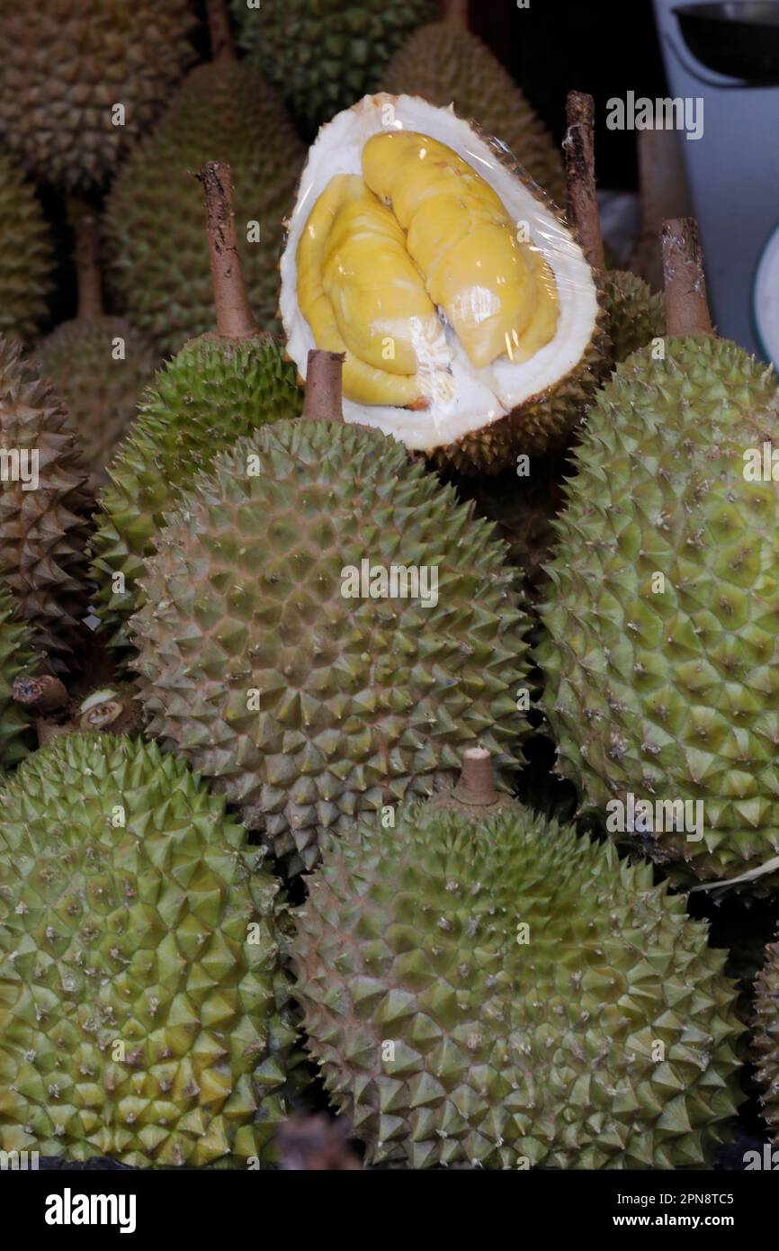 Selection of durians for sale on a small street fruit market in ...