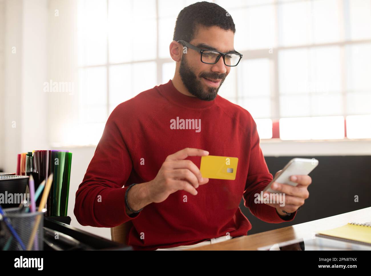 Hispanic male buying cell phone hi-res stock photography and images - Alamy