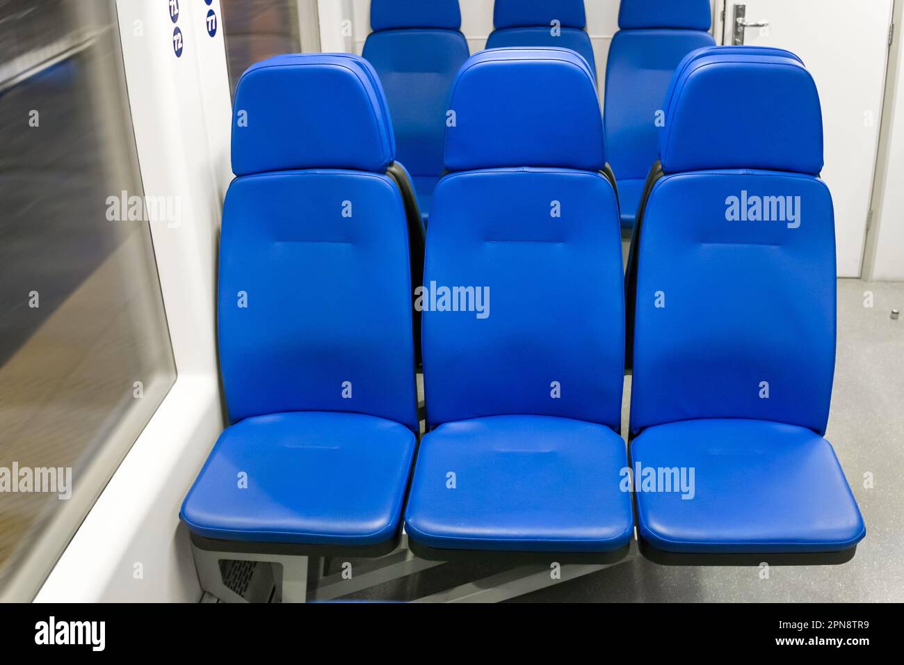 Empty interior of the train. Blue seats Stock Photo - Alamy