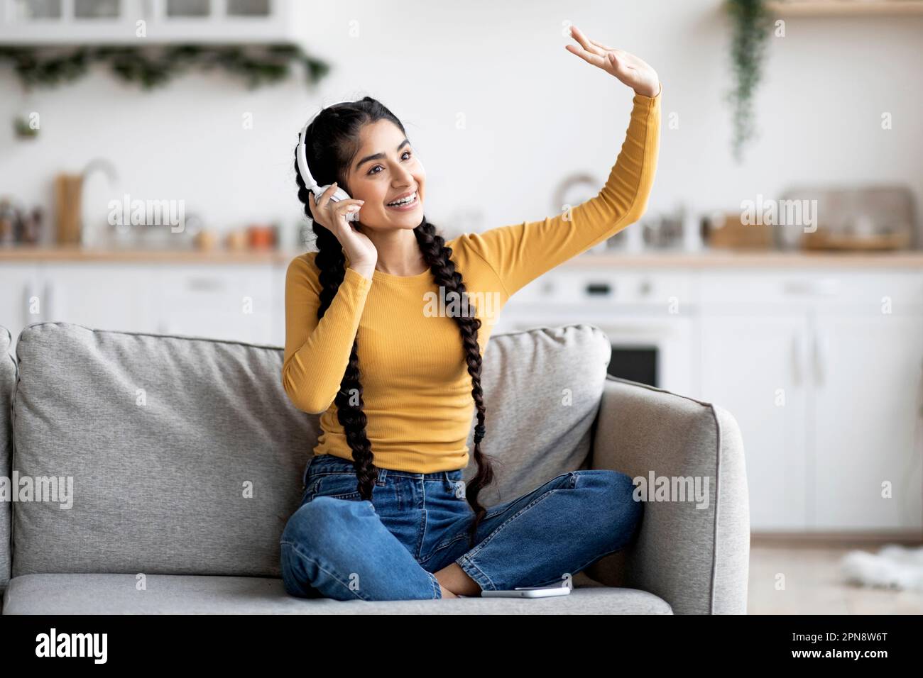 Favorite Pastime. Cheerful Young Indian Woman Listening Music In ...