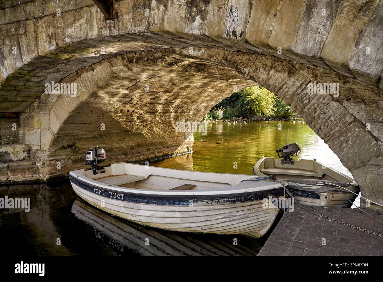 Clopton Bridge with boats moored underneath Stratford upon Avon England ...
