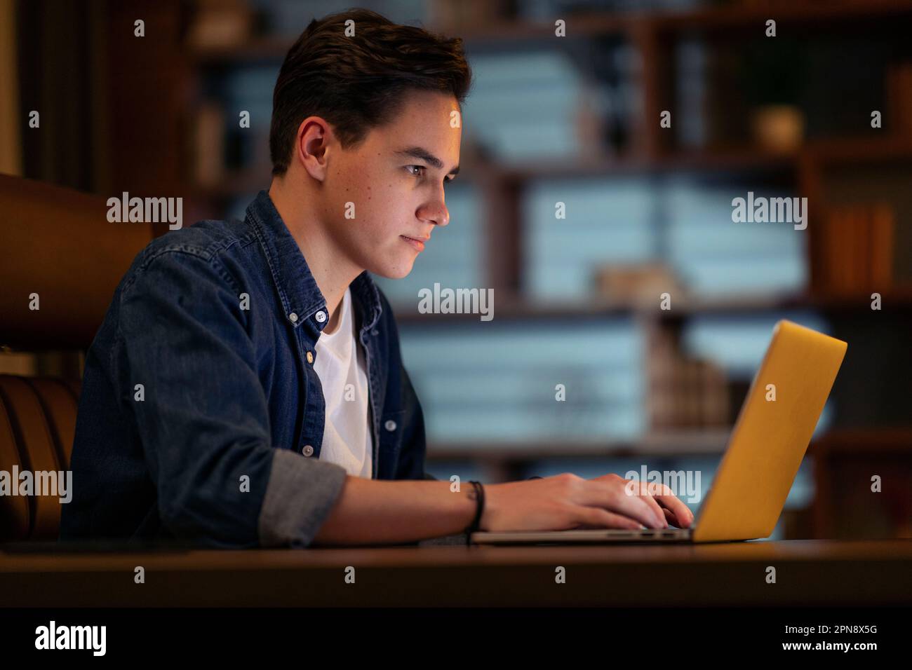 Concentrated young guy developer typing on pc keyboard, coding Stock ...