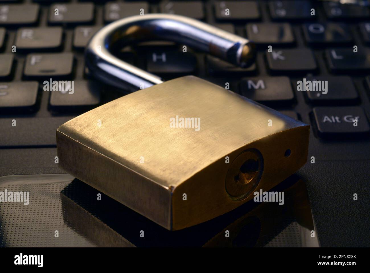 Detail of a metallic security padlock above a computer keyboard Stock ...