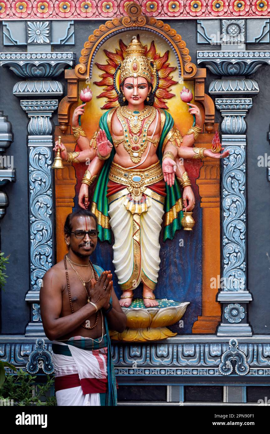 Sri Krishnan hindu temple. Hindu priest ( Brahmin ) performing puja ...