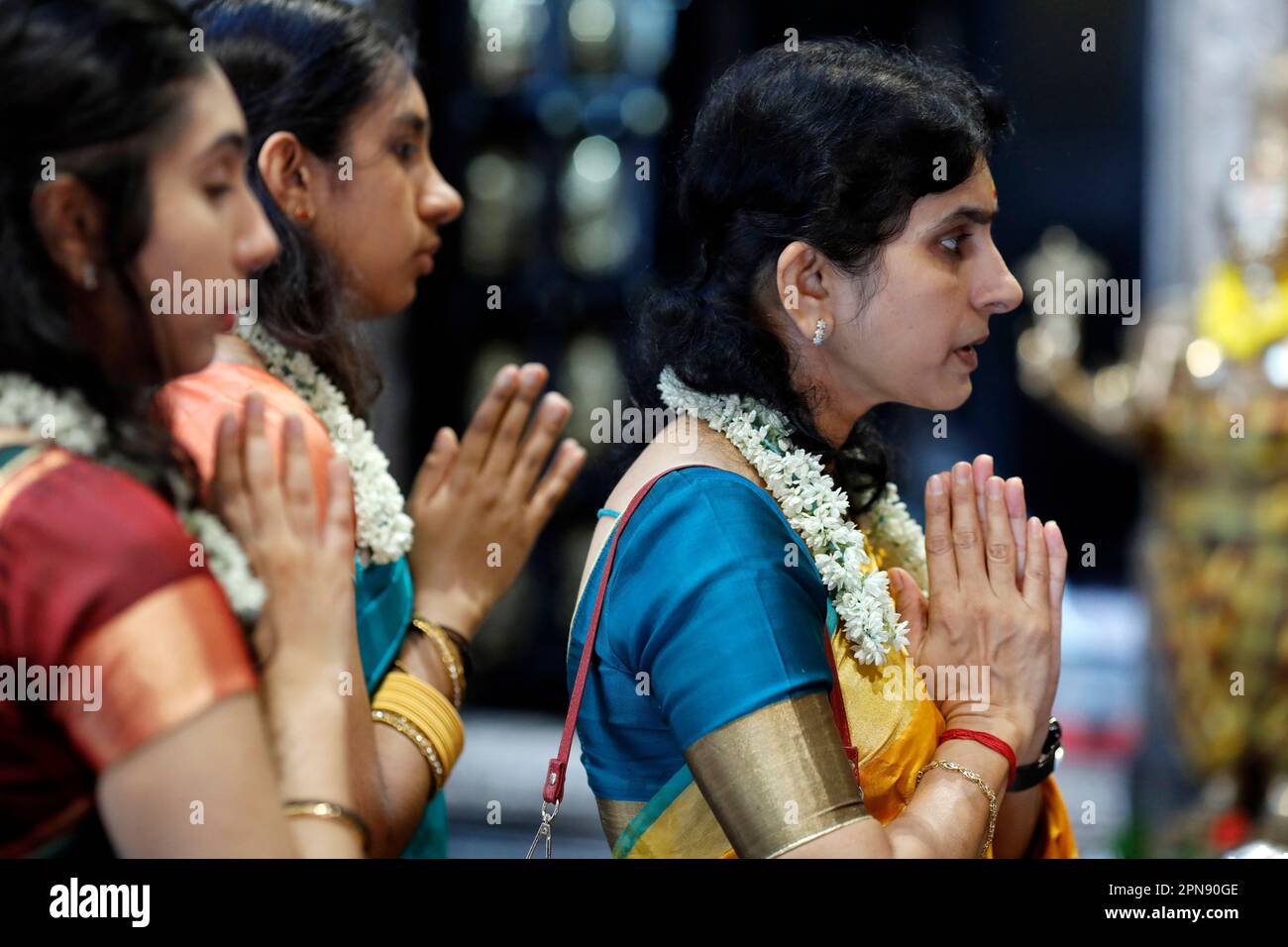 Sri Krishnan hindu temple. Women praying in temple. Singapore Stock ...