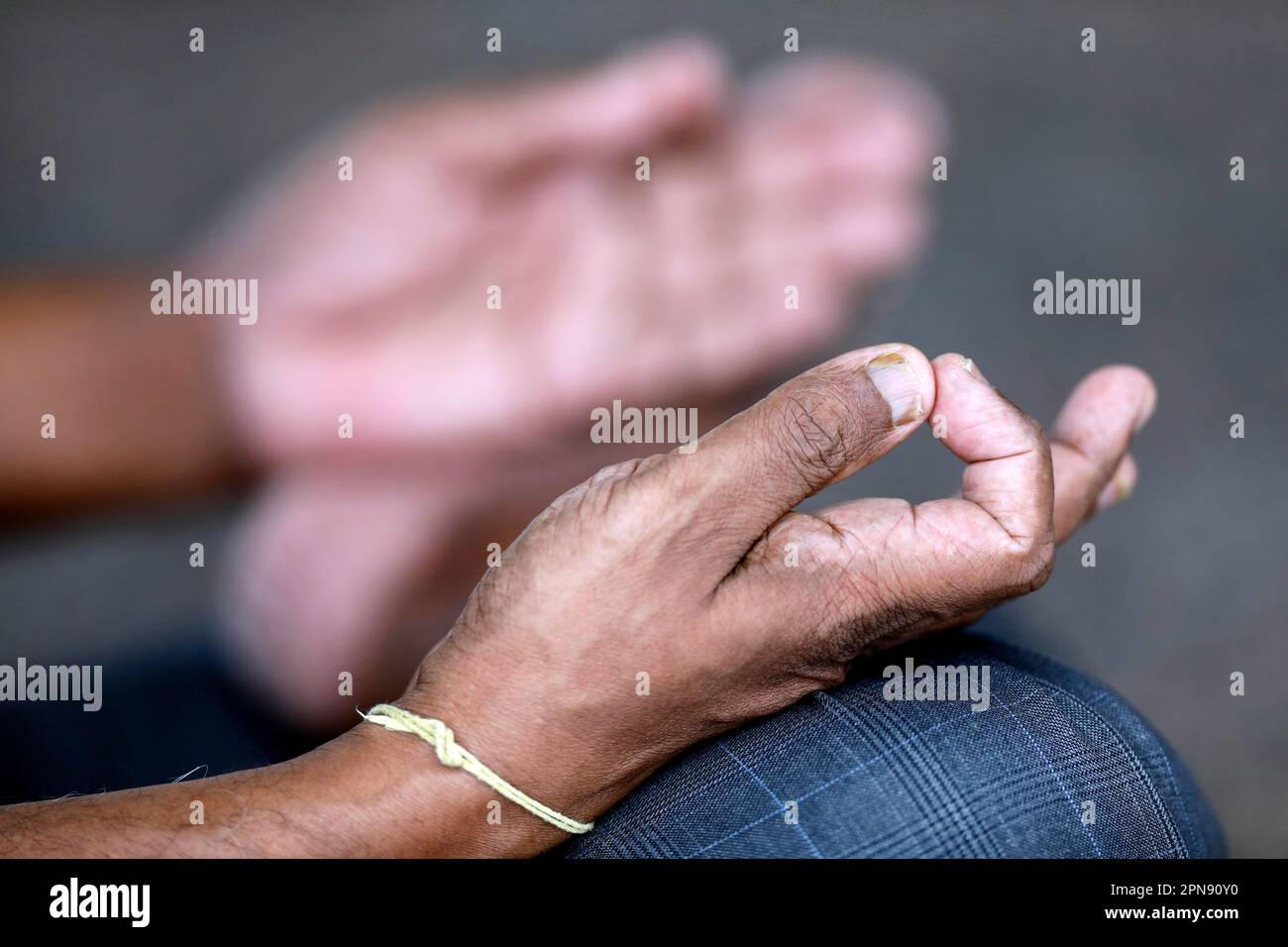Sri Srinivasa Perumal hindu temple. Man praying in temple. Close up on ...