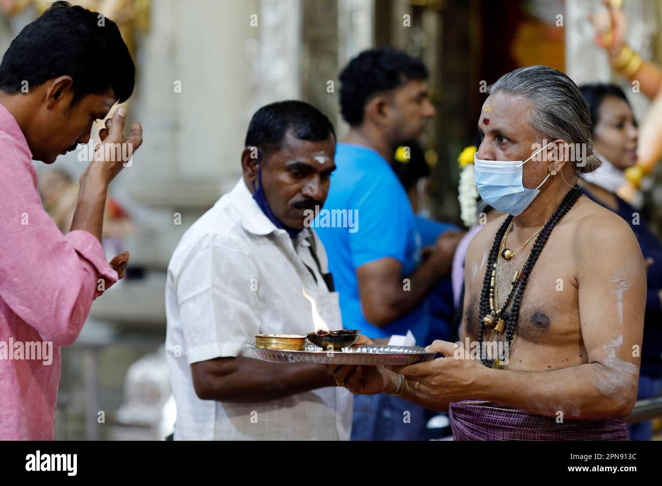 Sri Veeramakaliamman hindu temple. Hindu priest ( Brahmin ) performing ...