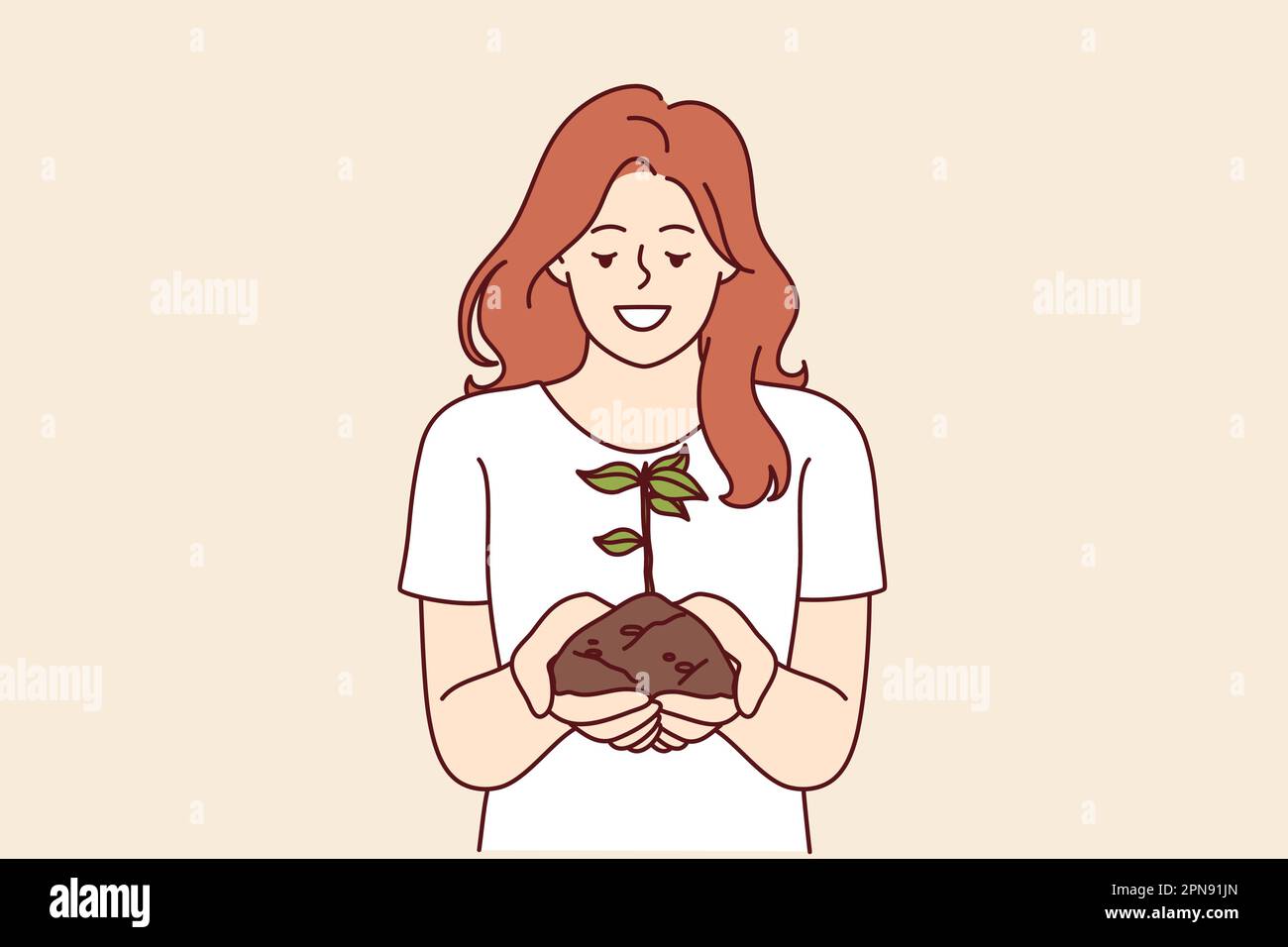 Woman holds handful of earth with plant drawing attention to problem of ...