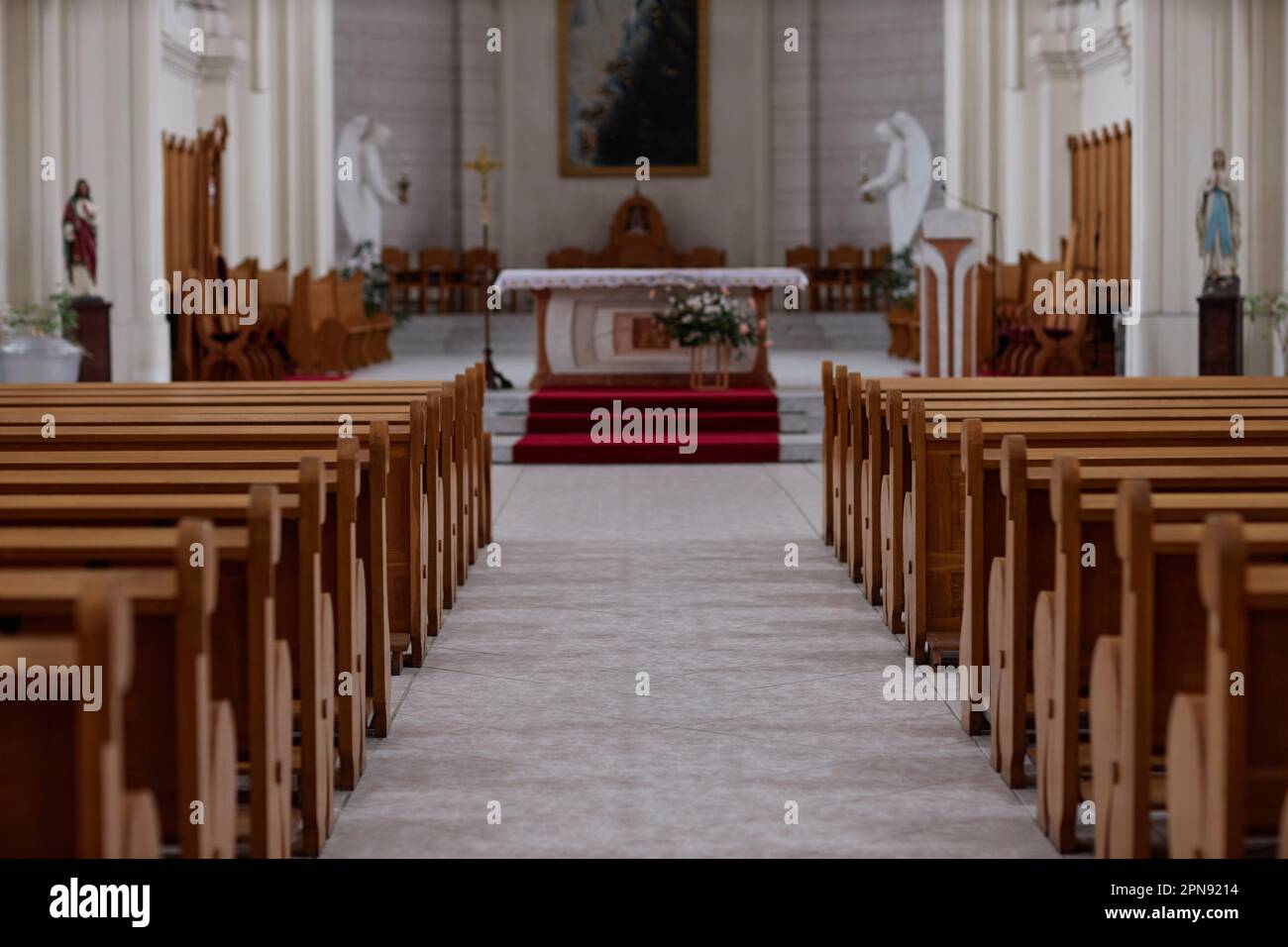 Horizontal image of empty old church with altar and wooden seats for ...