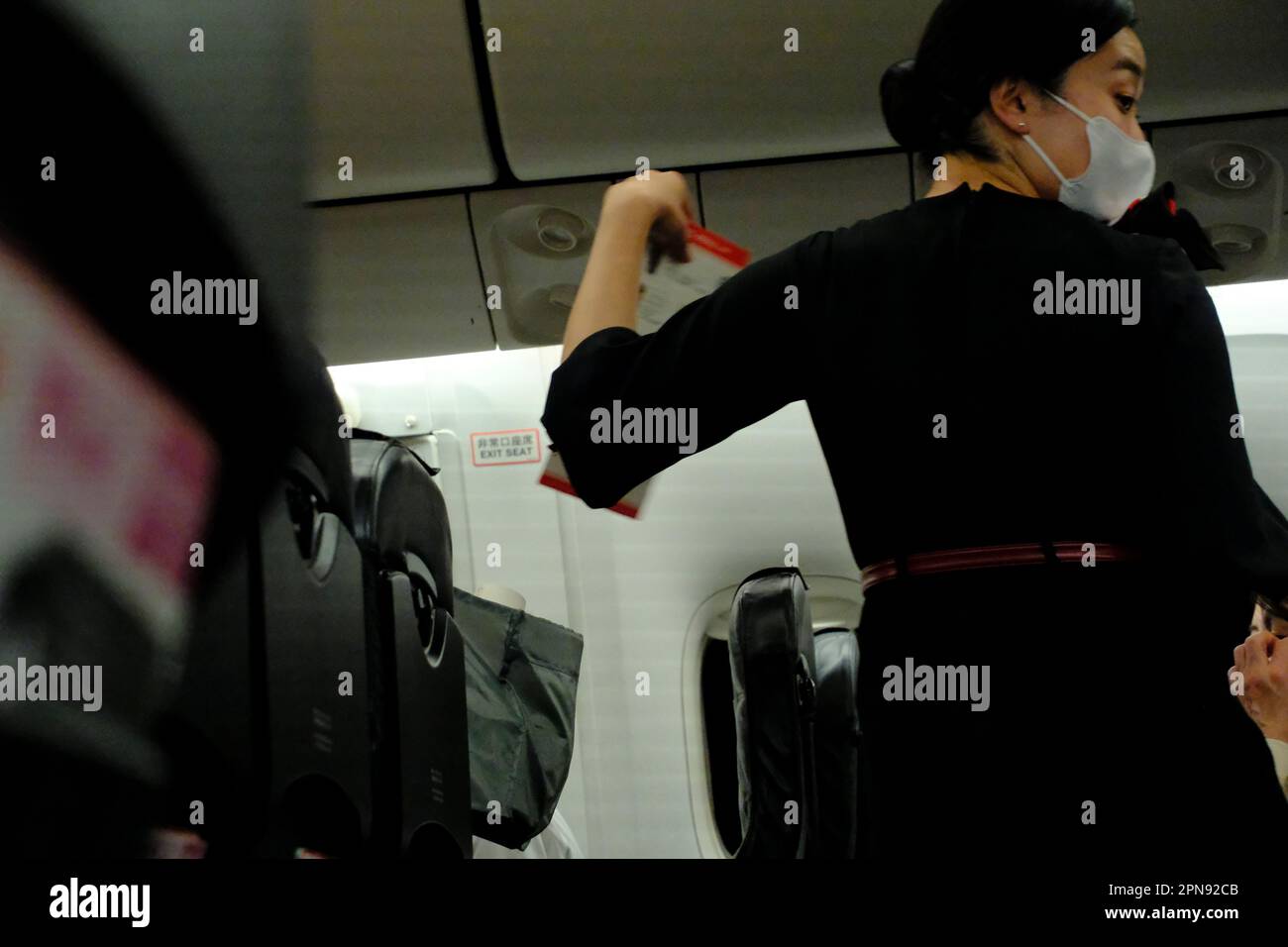 Tokyo, Japan. 17th Apr, 2023. A female JAL cabin attendant is wearing a ...