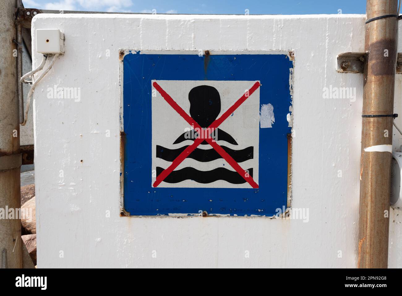Swimming prohibited sign in a harbour Stock Photo - Alamy