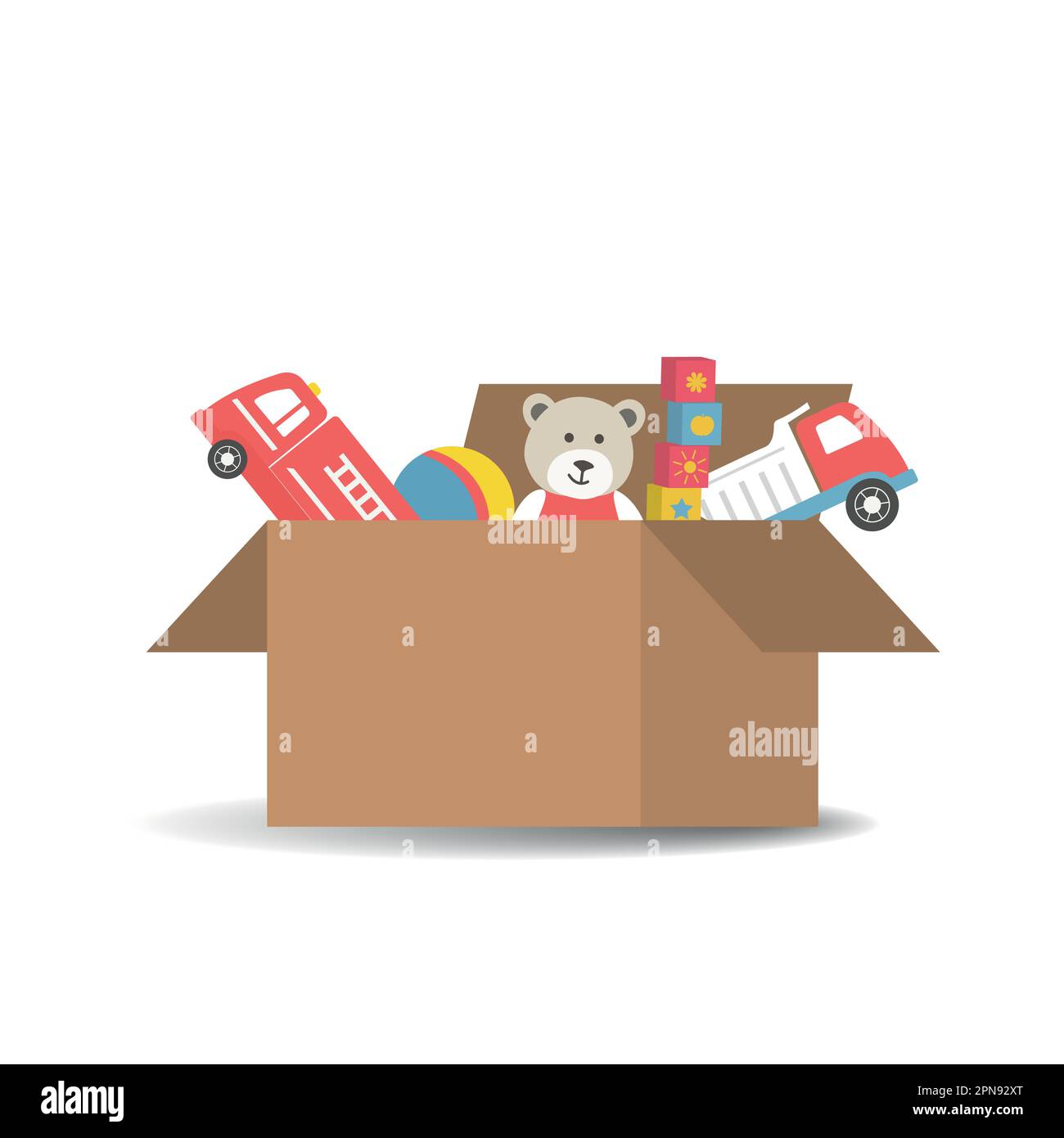 Children's toys in cardboard box. There is teddy bear, trucks, ball ...