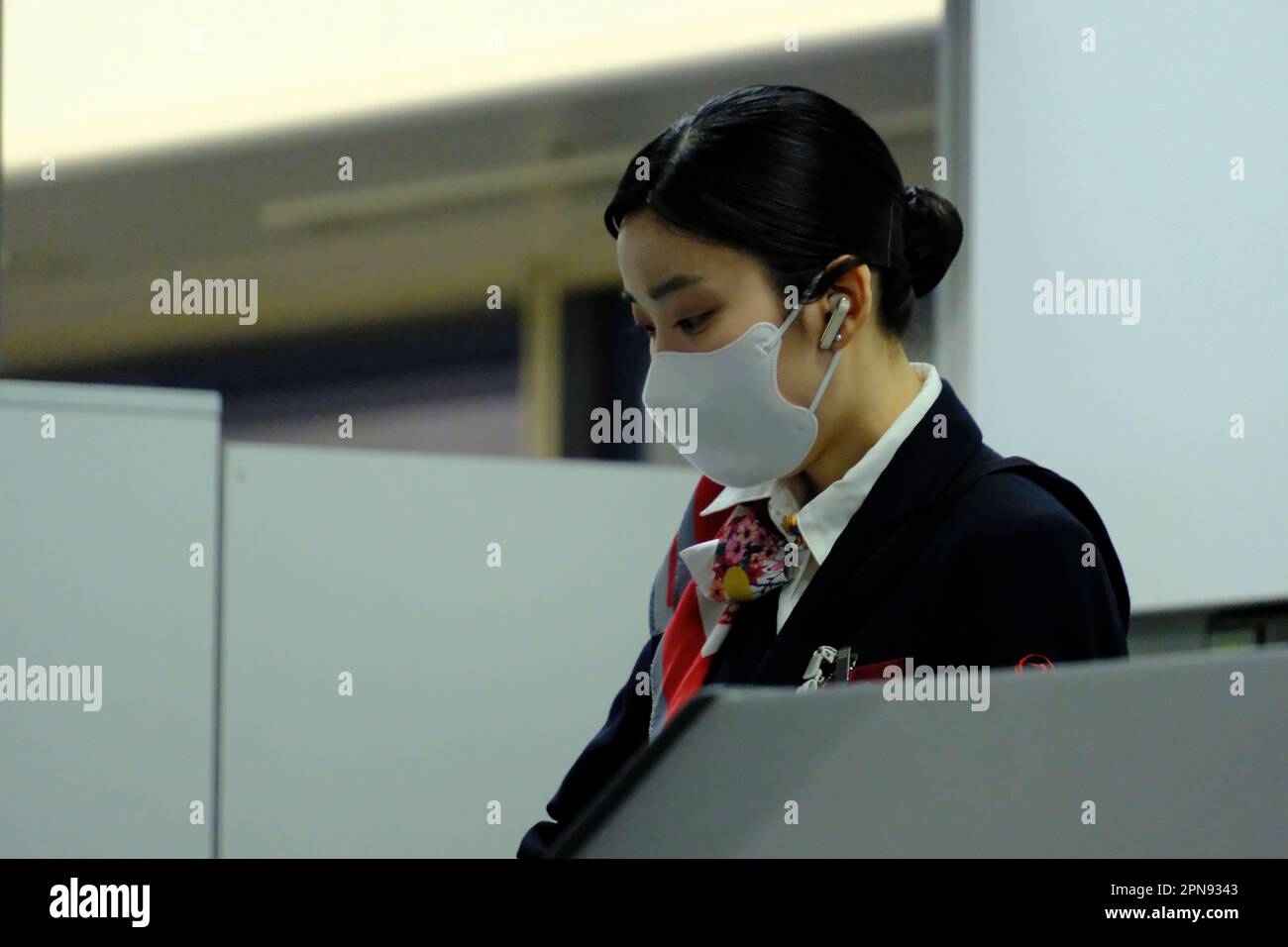 Tokyo, Japan. 17th Apr, 2023. A female JAL cabin attendant is wearing a ...