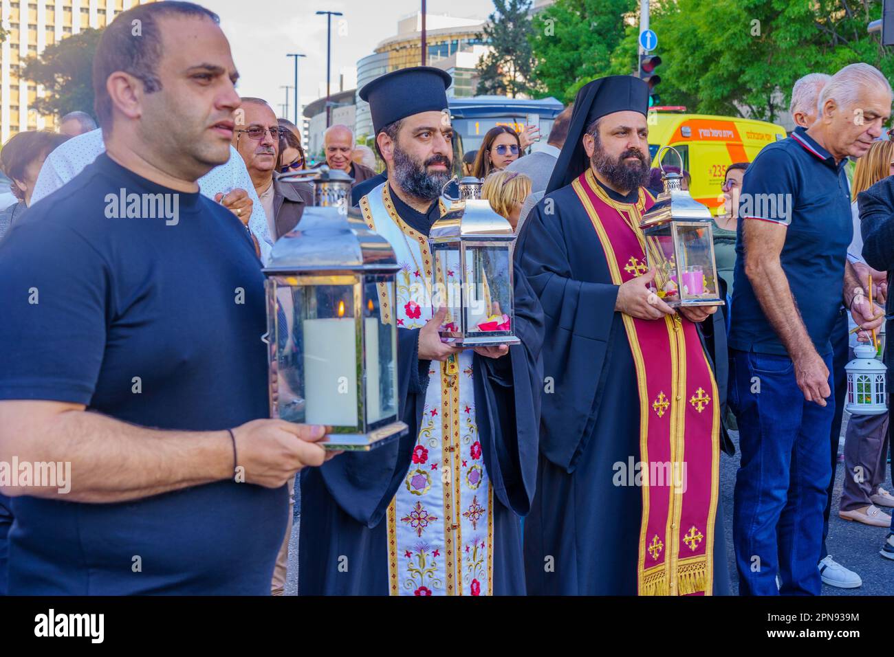 Haifa, Israel - April 15, 2023: Priest and locals carrying the holy ...