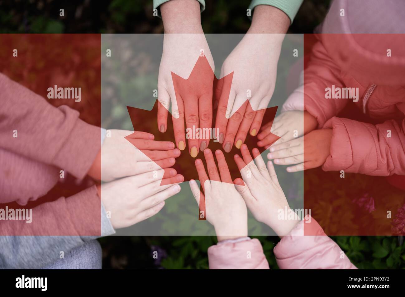 Hands of kids on background of Canada flag. Canadian patriotism and ...