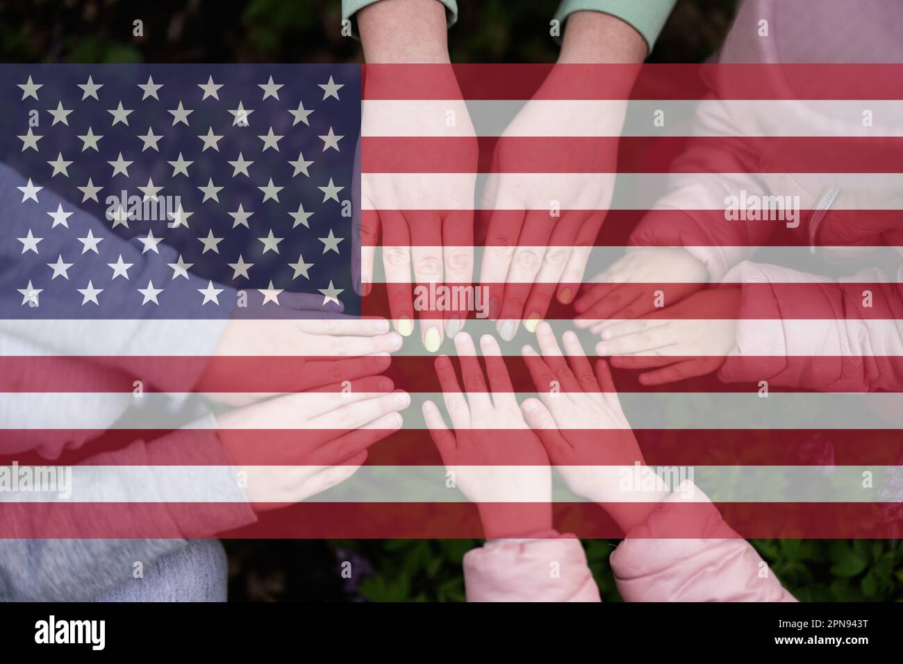 Hands of kids on background of USA flag. American patriotism and unity ...