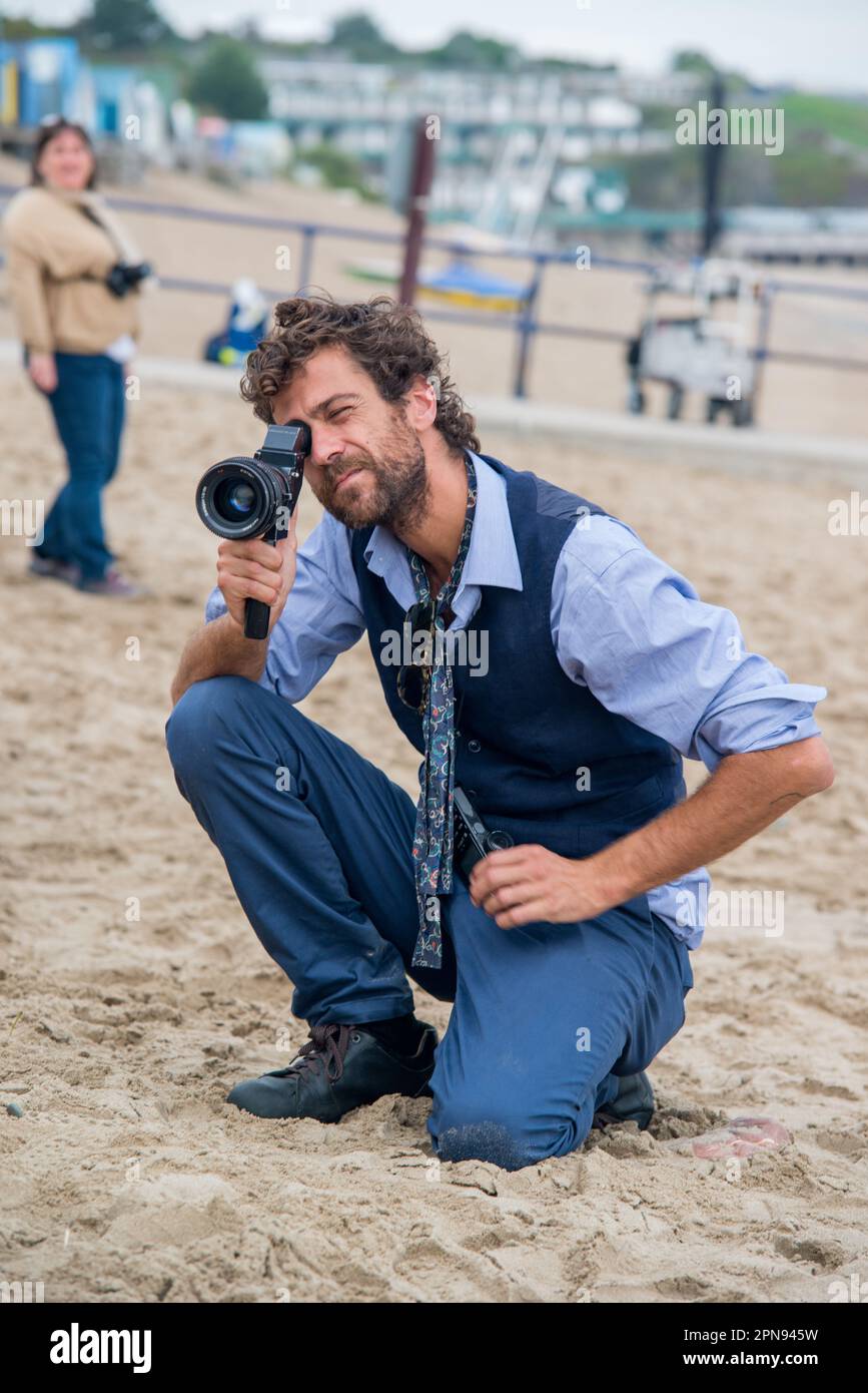 Film crew on coastal location using RED camera Stock Photo - Alamy
