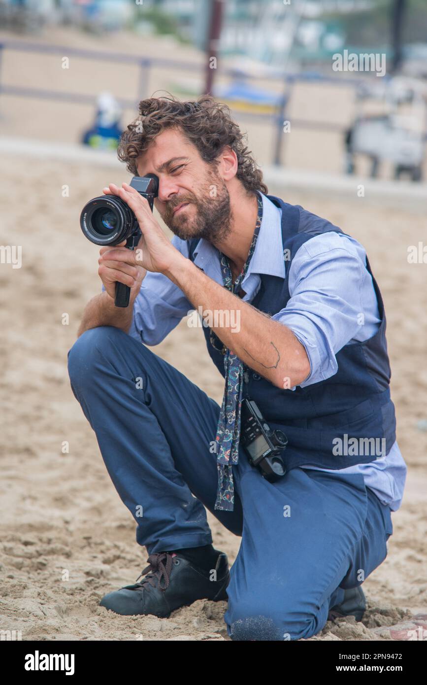 Film crew on coastal location using RED camera Stock Photo - Alamy