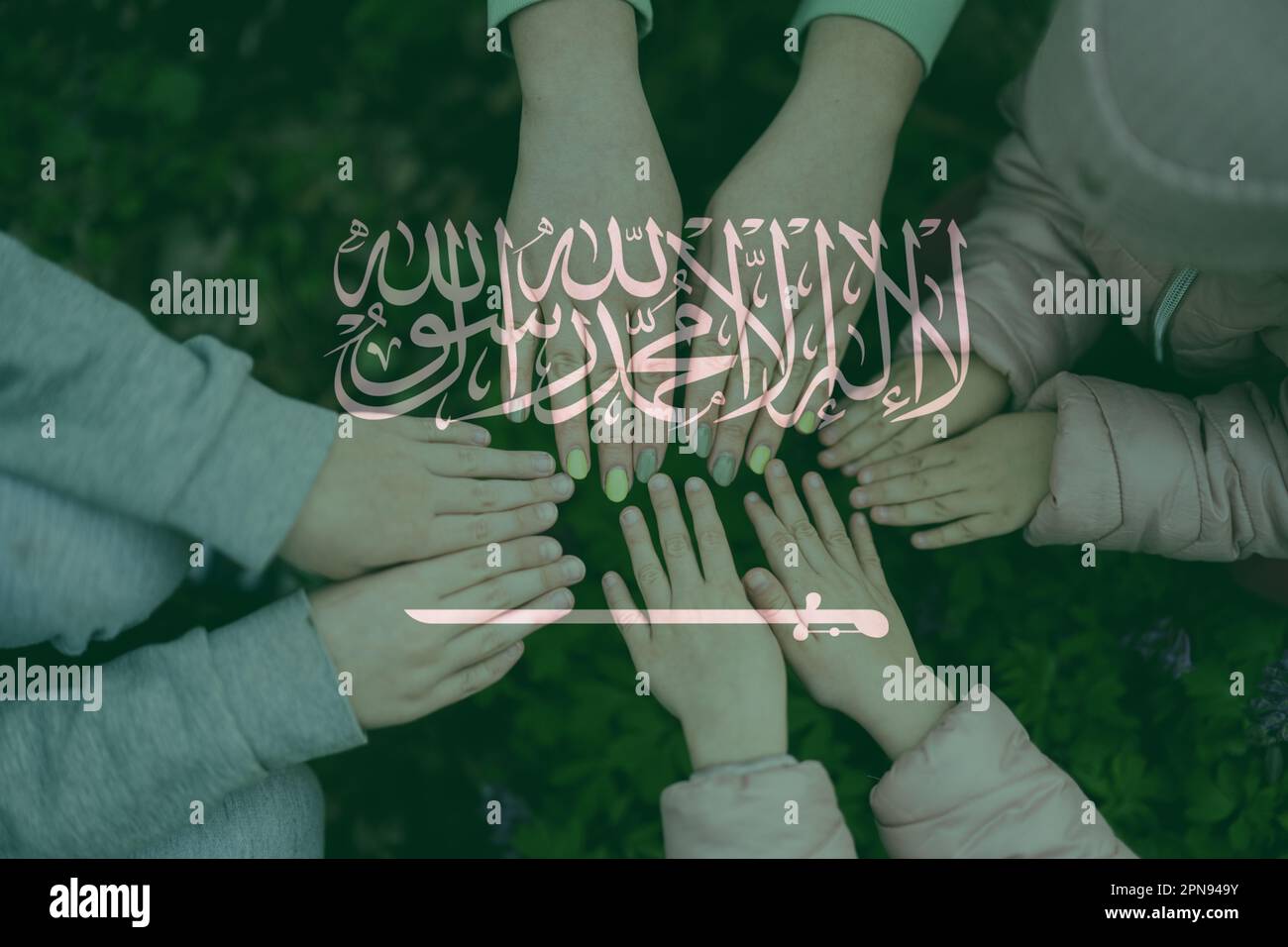 Hands of kids on background of Saudi Arabia flag. Saudi Arabian ...