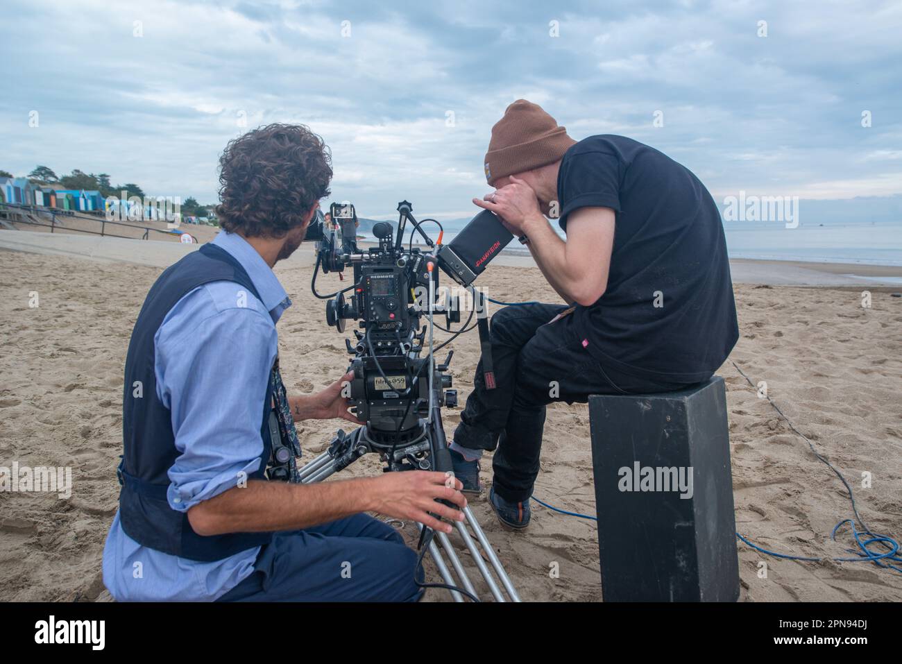 Film crew on coastal location using RED camera Stock Photo - Alamy