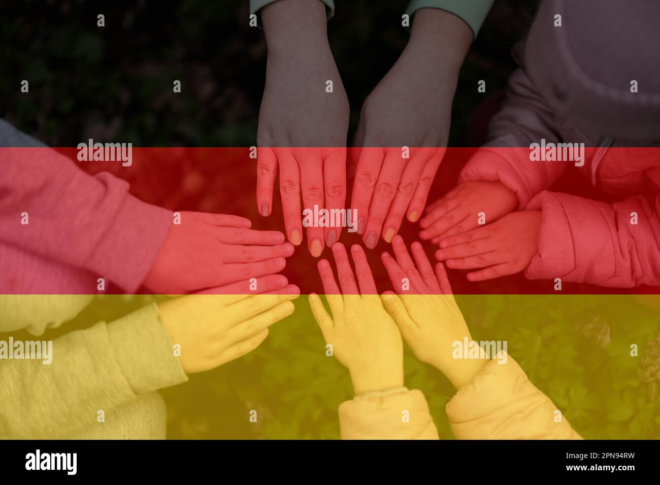 Hands of kids on background of Germany flag. German patriotism and ...