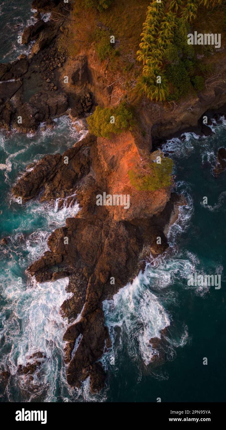 An aerial view of ocean waves splashing on rocks Stock Photo - Alamy