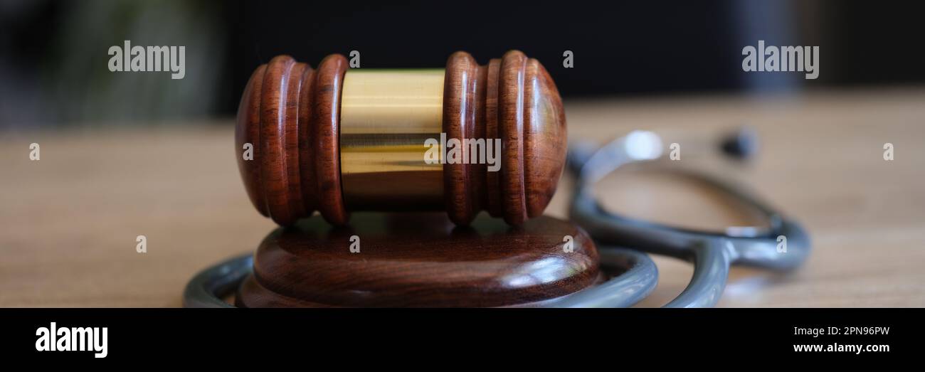 Judge gavel and doctor stethoscope on lawyer office desk Stock Photo ...