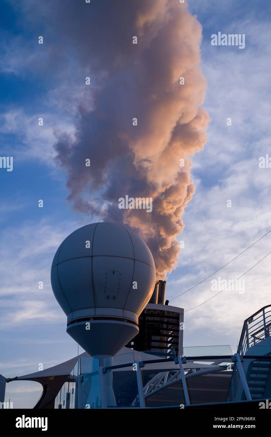 white smoke comes out of the chimney of the cruise ship Stock Photo - Alamy