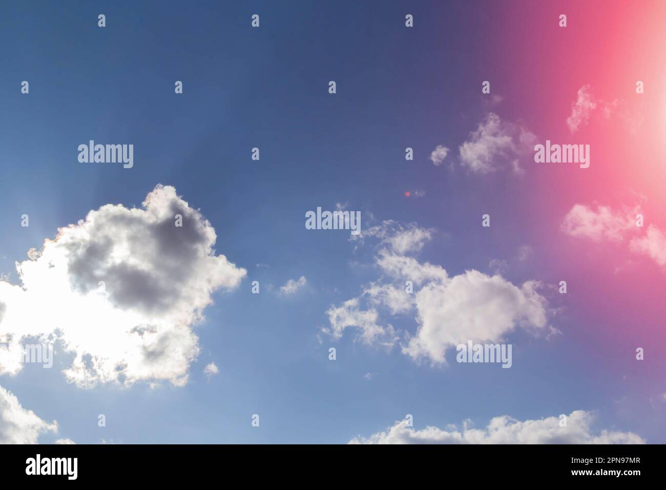 White airy beautiful clouds in a bright blue sky. Clear sunny weather ...