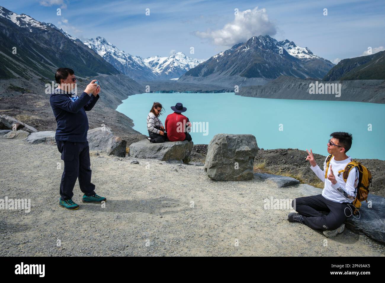 Tourists at Tasman Glacier Viewpoint with a view of Tasman Lake and ...