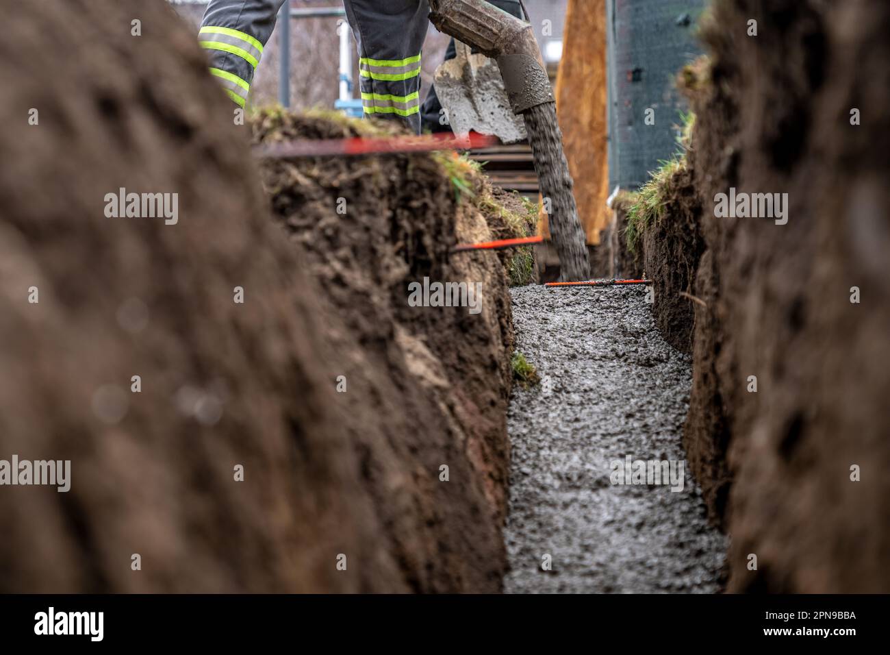 concreting from the pipe of the cement mixing car Stock Photo - Alamy