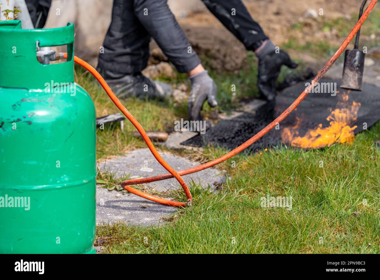 heating asphalt belts for waterproofing the foundation of the house ...