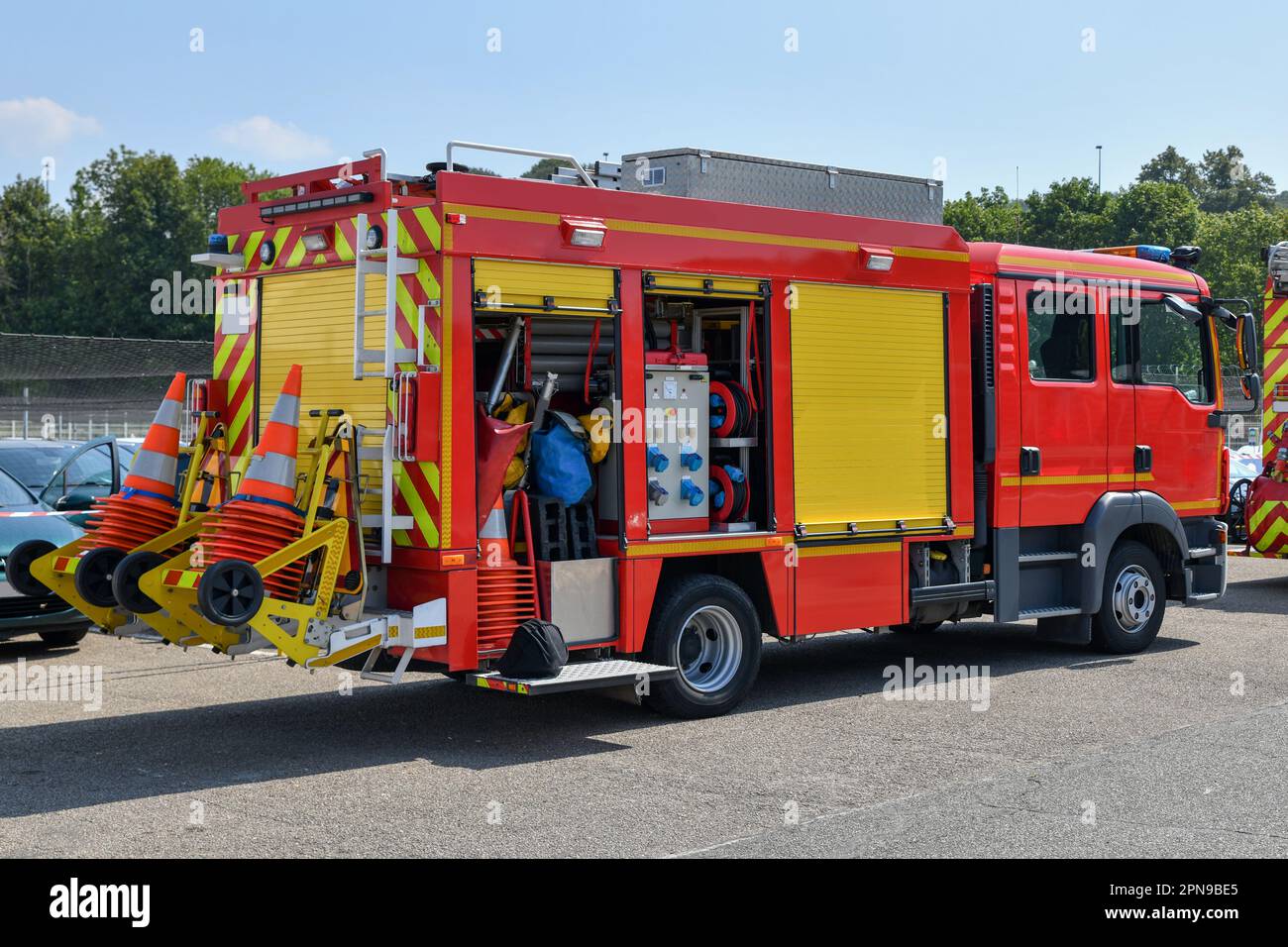 Big red fire truck with fire equipment Stock Photo - Alamy