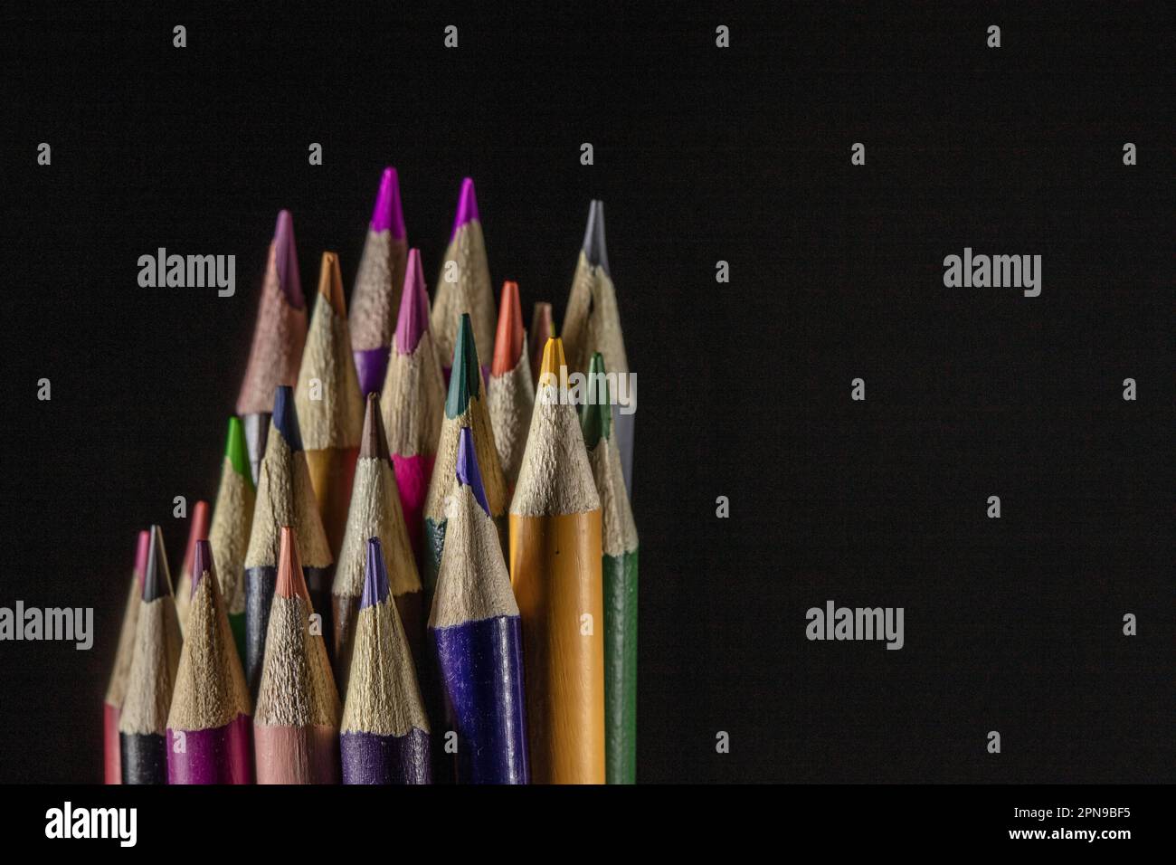 Dynamic close up still life of art coloured pencils grouped together in ...