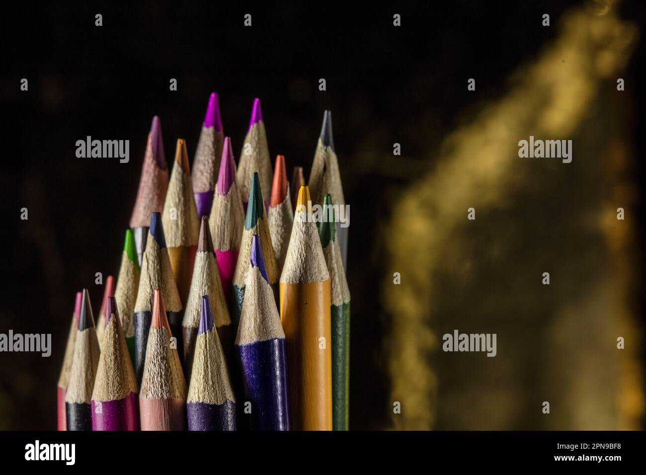 Dynamic close up still life of art coloured pencils grouped together in ...