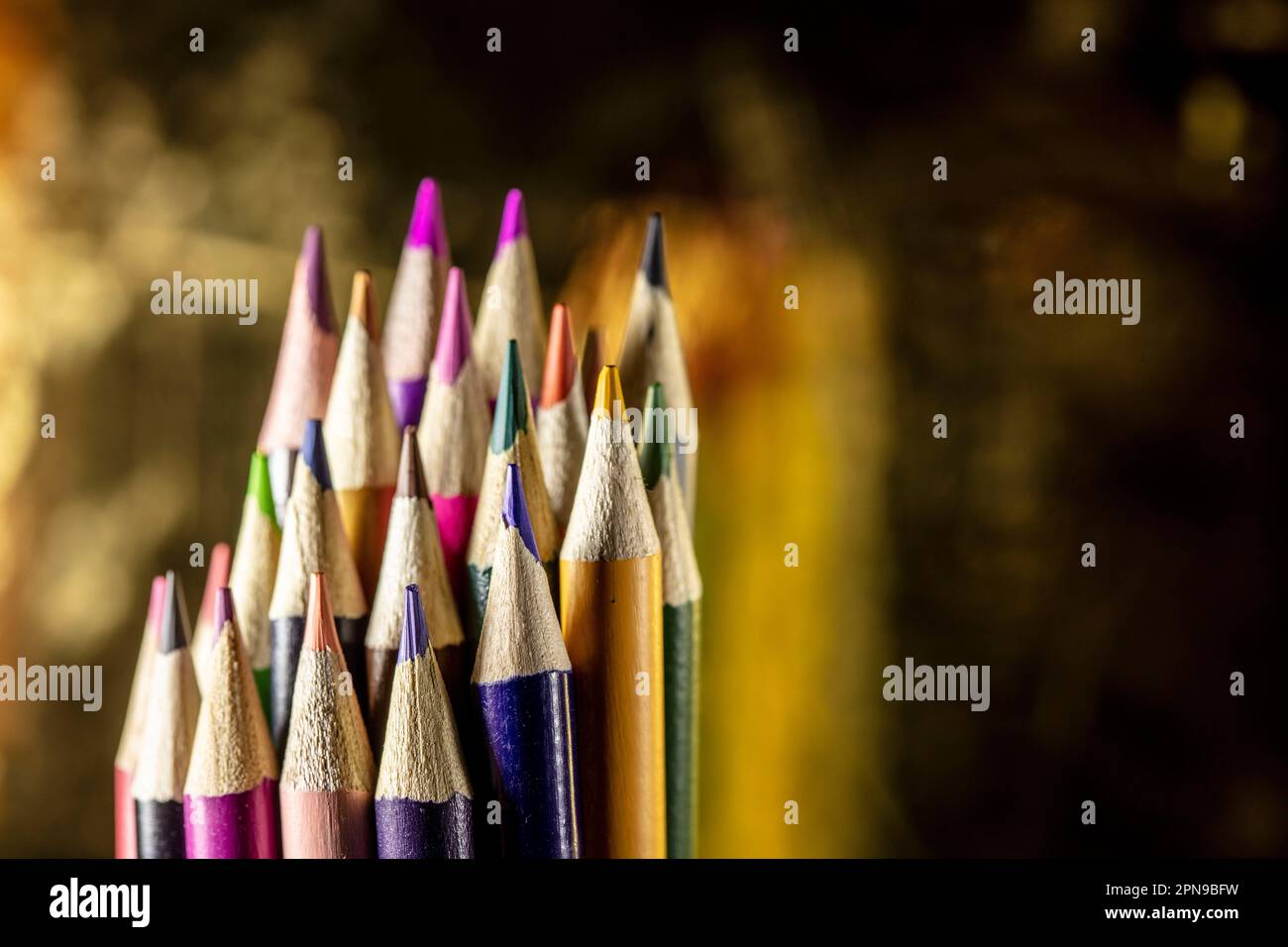 Dynamic close up still life of art coloured pencils grouped together in ...