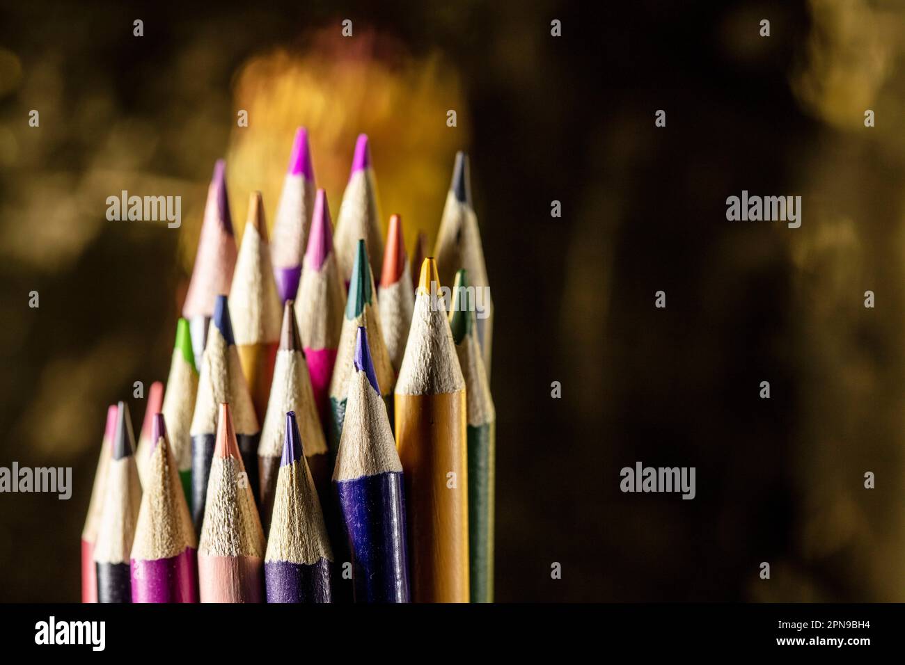 Dynamic close up still life of art coloured pencils grouped together in ...