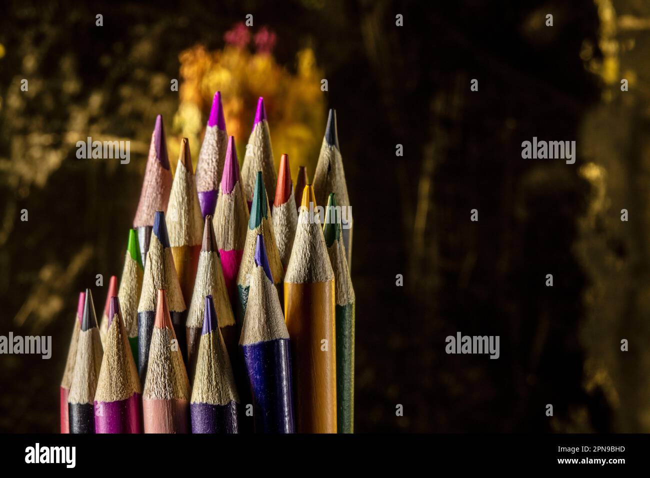 Dynamic close up still life of art coloured pencils grouped together in ...