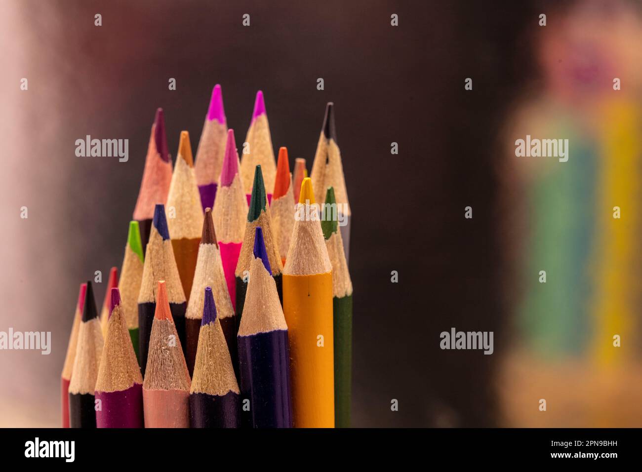 Dynamic close up still life of art coloured pencils grouped together in ...