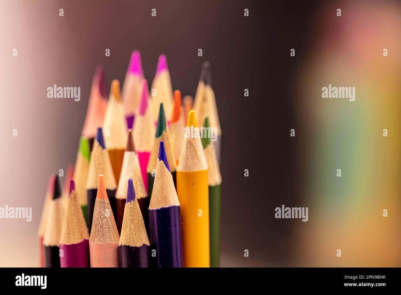 Dynamic close up still life of art coloured pencils grouped together in ...