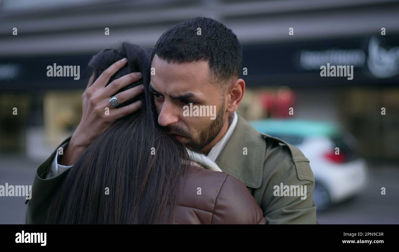 Couple embrace in empathy calming partner during difficult times. A ...