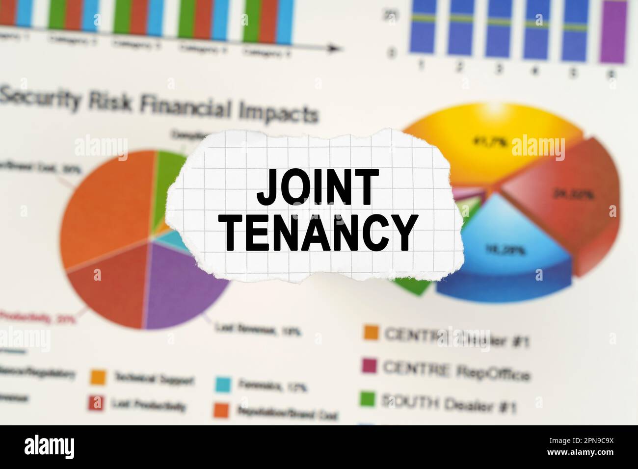 Business concept. On diagrams and graphs lies torn paper with the ...