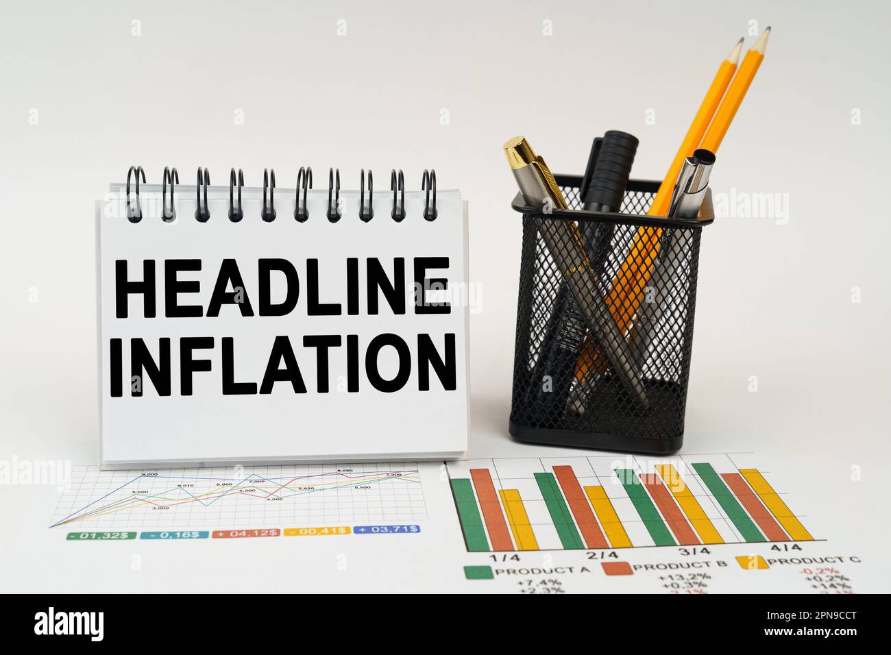 Business concept. On the table are business charts, office supplies and ...